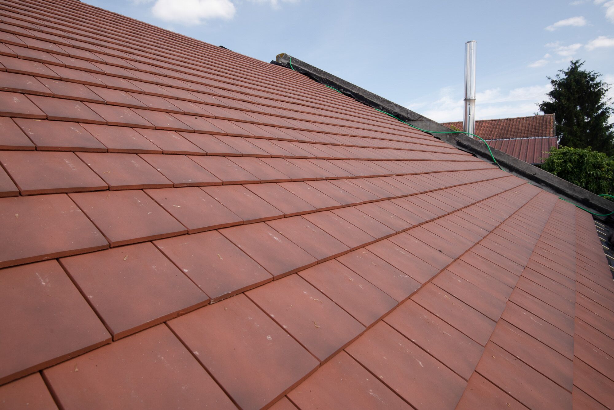 Couverture toiture Tuiles plates, ardoises ou tuiles mécaniques